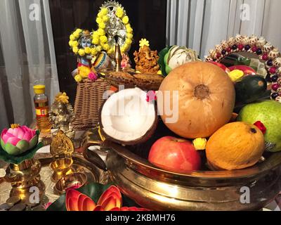 Traditional Vishu kani (Vishukani) setting with small idols of Lord ...