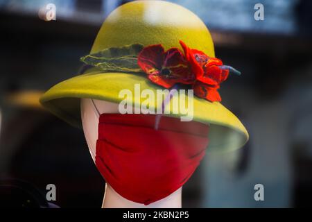 A mannequin, with mouth mask, is seen on the first day of relaxing ...