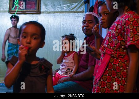 Rohingya wait before performs a evening prayer after break their fast ...