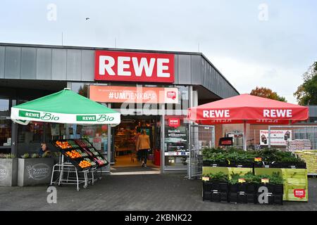 The entrance of a Rewe supermarket Stock Photo - Alamy