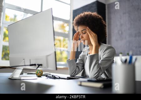 Stressed Sick African American Employee Man At Computer Stock Photo - Alamy
