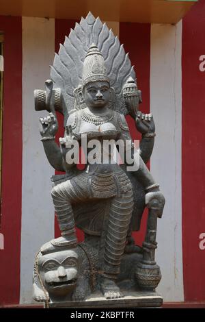Statue of a female guardian deity at the entrance of the at the ...