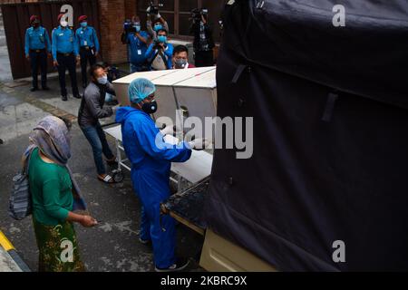 People load a coffin carrying body of Nepalese migrant worker who died ...