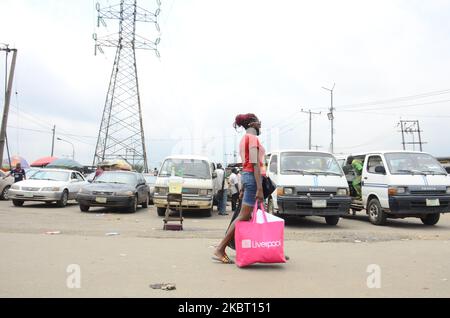 Travelers arriving at at Opebi/Onigbongbo branch B Owena park Ojota bus ...