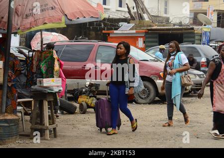 Travelers arriving at at Opebi/Onigbongbo branch B Owena park Ojota bus ...