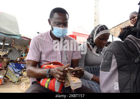 Nigerian money - naira in a counting machine Stock Photo - Alamy