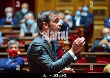 French Health Minister Olivier Veran leaves the weekly cabinet meeting ...