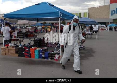 Workers sanitize the streets of Ciudad Juarez, Mexico, on July 24, 2020 ...