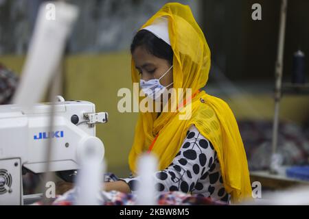 Ready-made garments worker works in a garments factory in Dhaka ...