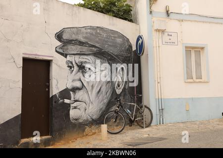 The smoking man mural, Lagos, Algarve, Portugal Stock Photo - Alamy