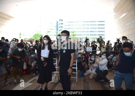 Angus Chau and Joshua Wong are seen posing for a photo before appearing ...