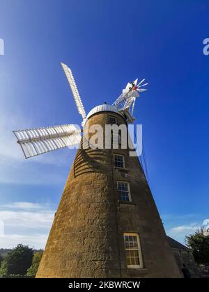 Low angle shot of a windmill against a blue sky Stock Photo - Alamy