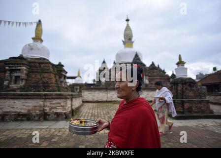 Nepalese devotees arrive to offer ritual prayer towards Nag or Snake ...