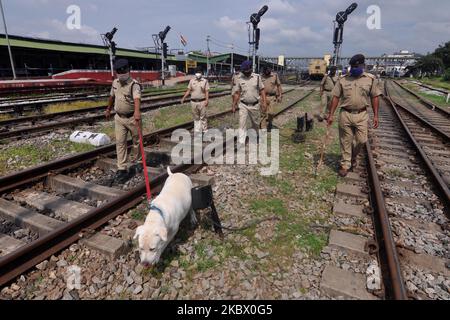 Railway Police Force (RPF) personnel inspect the platform along with a ...