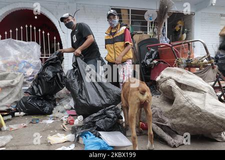Mexico City, CDMX, Mexico, Garbage collectors working in the street of ...