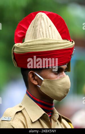 Indian Police personnel wearing face masks march during an Independence ...