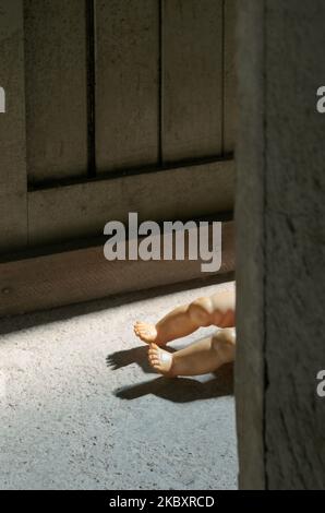 doll lying on floor Stock Photo - Alamy