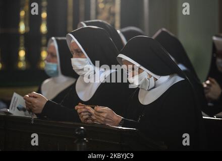 A group of nuns seen praying ahead of the funeral mass inside the ...