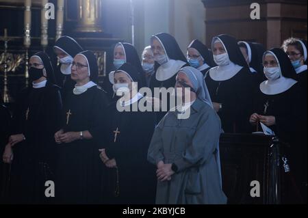 A group of nuns seen praying ahead of the funeral mass inside the ...