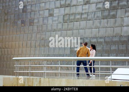 tourists taking a selfie, visiting Bilbao city, Basque country, Spain ...