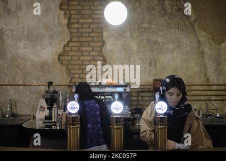 An Iranian cafe-woman works in a cafe in downtown Tehran on December 9 ...