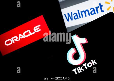 In this photo illustration, the Oracle logo is displayed on the screen ...