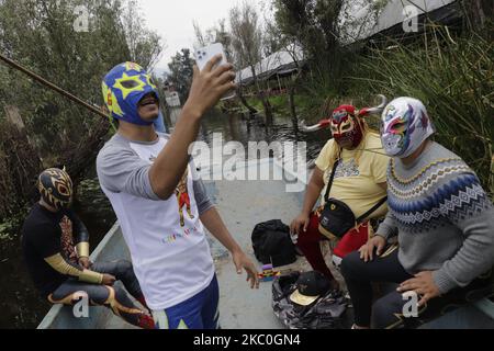 Members of Chinampaluchas, during a wrestling function, fight against ...