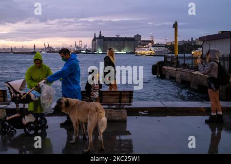 People run from heavy rainfall in Istanbul, Turkey on October 19, 2020 ...