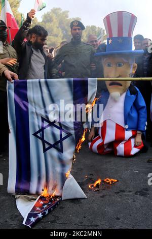 Iranian demonstrators burn representations of the U.S. and Israeli ...