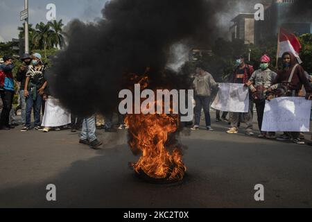 Jakarta, Indonesia, 28 October 2020 : Students sit on the street during ...