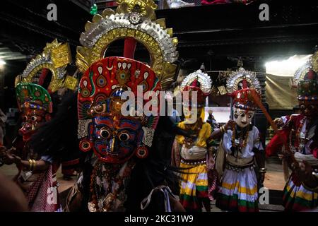 A man attired as deity performs traditional mask dance during Navadurga ...