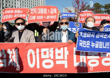 Supporters of former South Korean President Yoon Suk Yeol hold signs ...