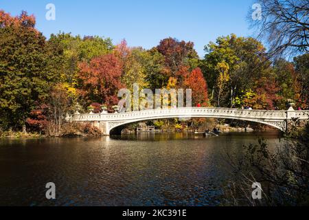 Bow Bridge and fall colors in Central Park with Manhattan Upper West ...