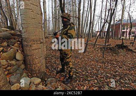 A soldier guards a polling station during the presidential runoff ...