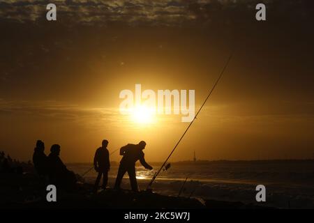 Palestinians enjoy their time during sunset at a beach in Gaza City, 13 ...