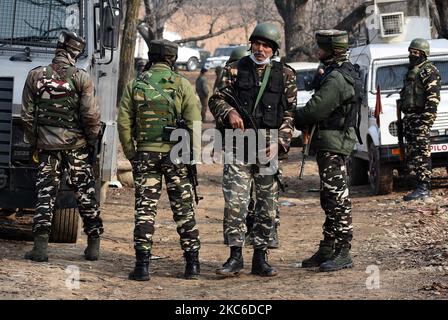 Indian security forces stand near the site of an explosion inside a ...