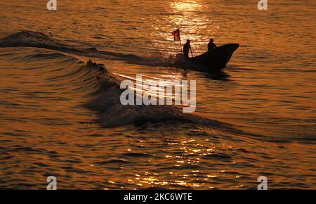 Palestinian fishermen ride a boat at the seaport of Gaza City before ...
