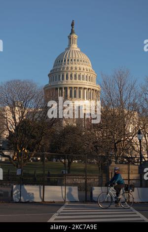 A fence and barricades set up around the US Capitol building in ...