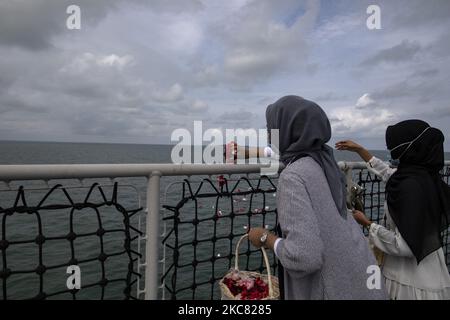 Jakarta, Indonesia, 22 January 2021 : Other families victim of the air plane crash cool down an ...