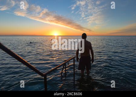Swimmers at the Vico bathing place, Hawk Cliff, in Dalkey, during Level ...