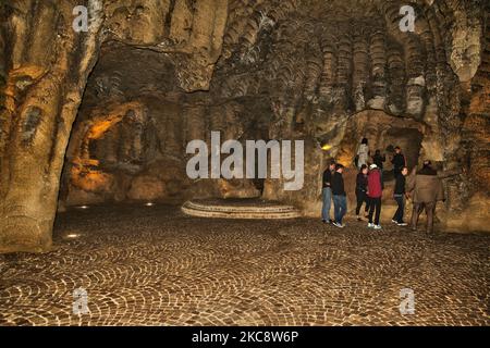 Arab tourists walk through the Caves of Hercules (Grottes d'Hercule) in ...