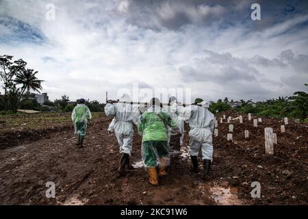 Graveyard digger carried the coffin to the graveyard as ambulance can ...
