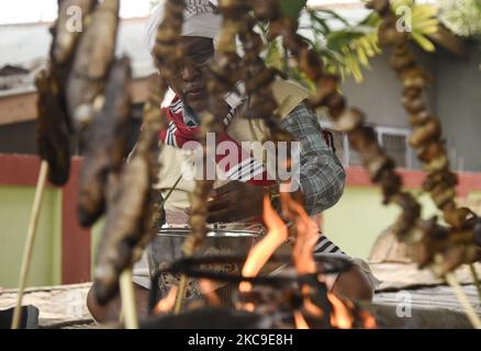 Mising tribal people preparing traditional food during Ali-Aye-Ligang ...