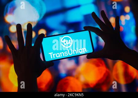 In this photo illustration the TransUnion logo is seen on a smartphone ...