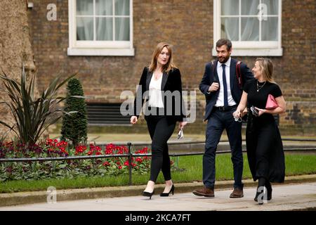 Government Press Secretary Allegra Stratton (L) walks along Downing ...