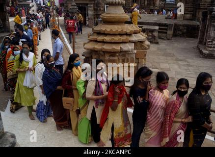 Indian Hindu devotees wait for turn to register for the annual ...