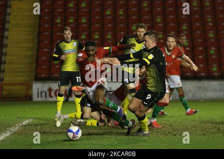 Hayden White of Walsall battles with Barrow's Scott Quigley during the ...