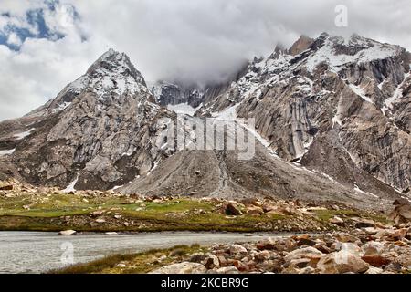 Himalayan mountains surround glacial lake in a remote valley in Zanskar ...