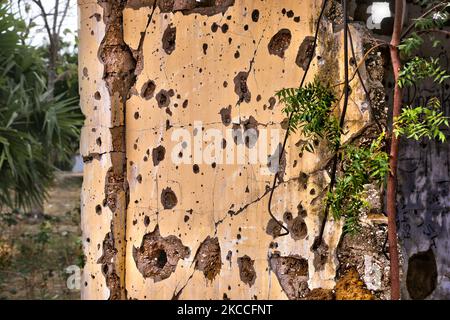 Remains of a building riddled with bullet holes during the civil war in ...