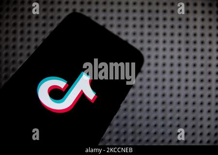 In this photo illustration a TikTok logo seen displayed on a smartphone ...